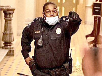 Capitol police officer Eugene Goodman hailed as ‘a hero’